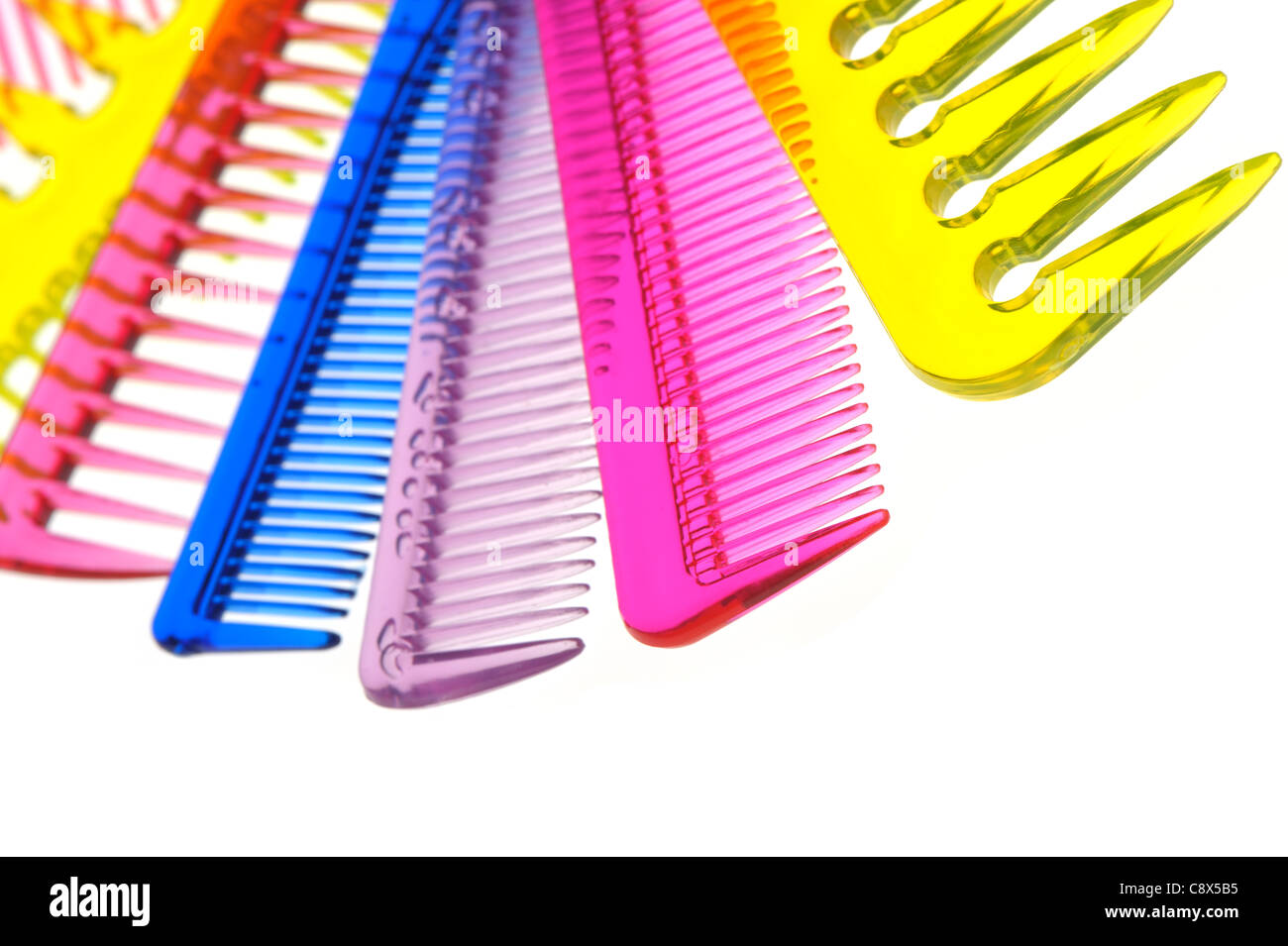 Set multi-coloured transparent combs. It is photographed on a gleam. It ...