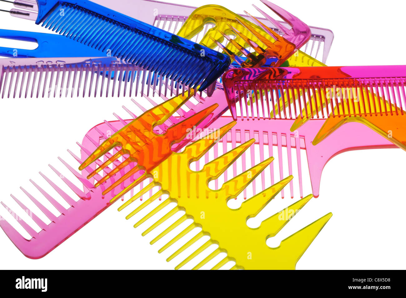 Set multi-coloured transparent combs. It is photographed on a gleam. It ...