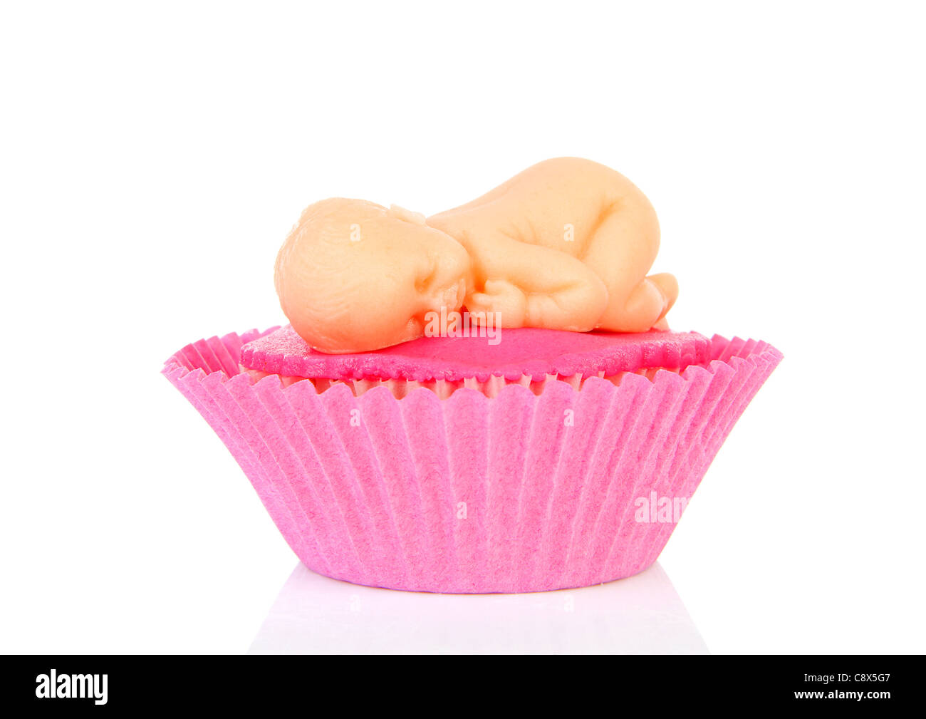 Pink Birth cupcake with marzipan baby over white background Stock Photo ...