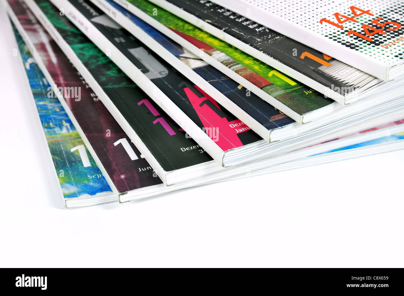 Pile of various multicolored magazines on white background Stock Photo ...
