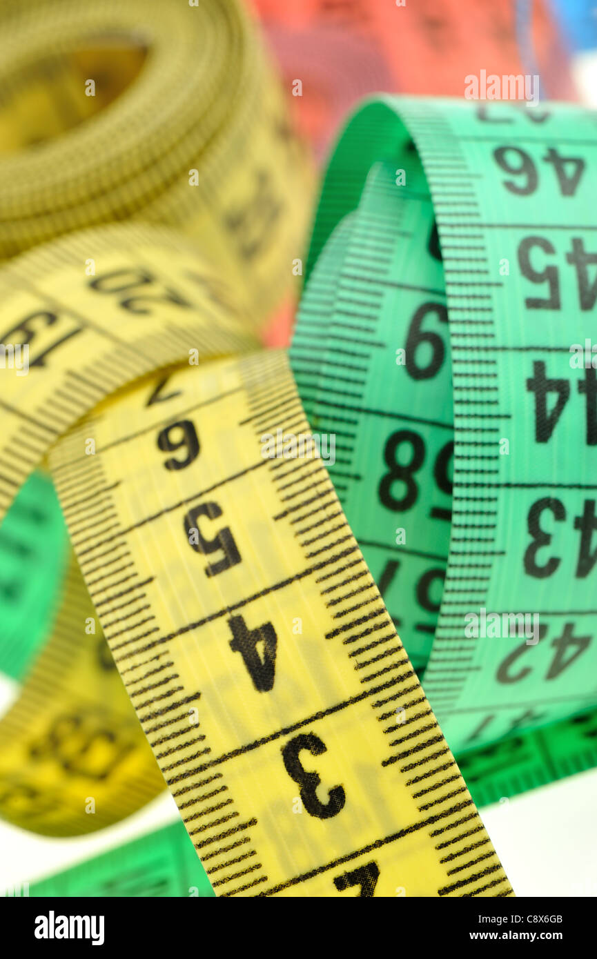 Measuring tape of the tailor. Abstract color background Stock Photo - Alamy