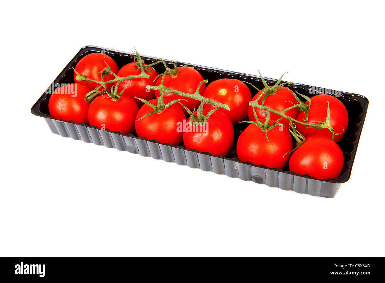 box with fresh tomatoes over white background Stock Photo - Alamy