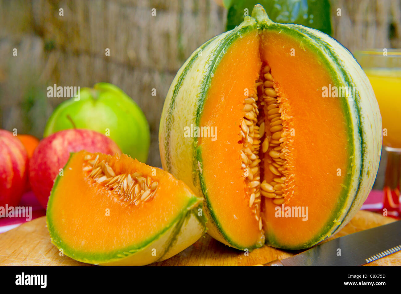 Cut melon and other fruit Stock Photo - Alamy