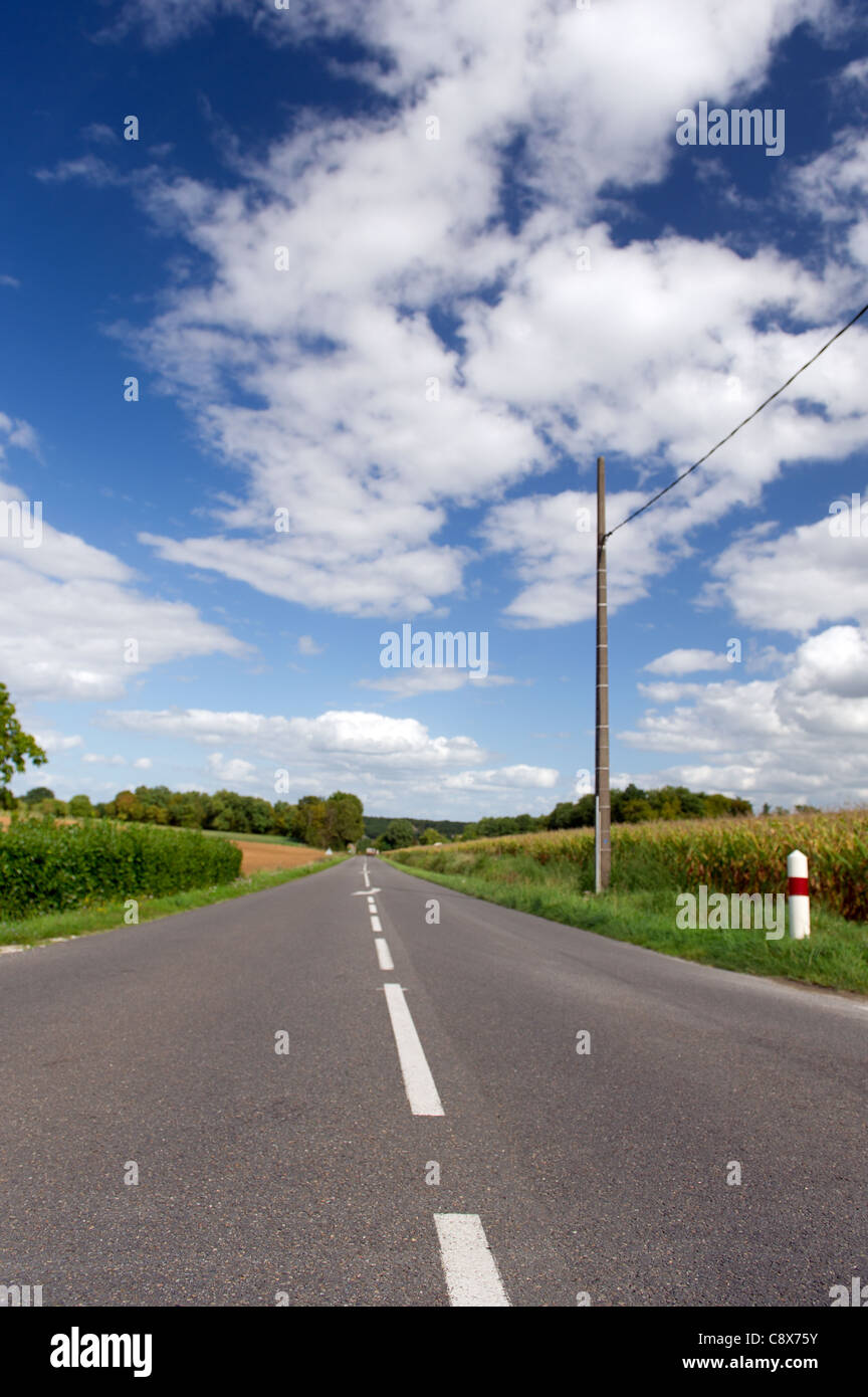 Empty road in agriculture environment Stock Photo - Alamy