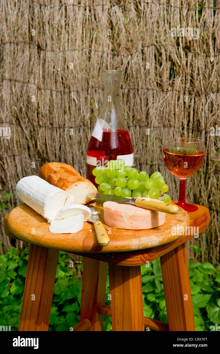 Cheese board outdoor with cheese bread and wine Stock Photo - Alamy
