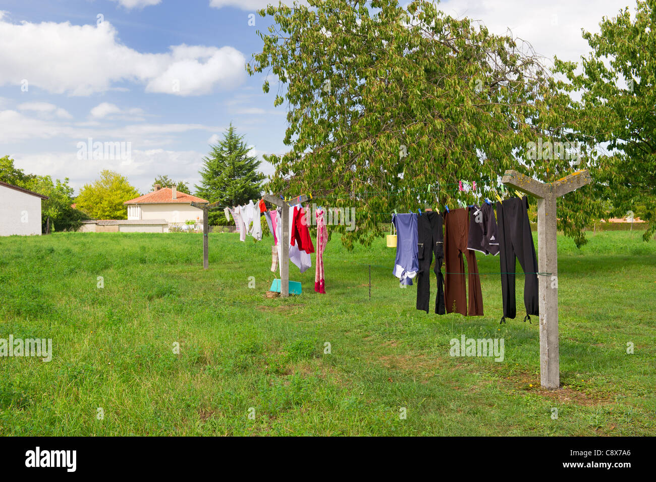 Hanging laundry at line outdoor in the garden Stock Photo - Alamy