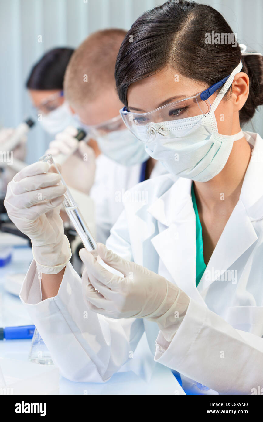 A Chinese Asian female medical or scientific researcher or doctor using ...