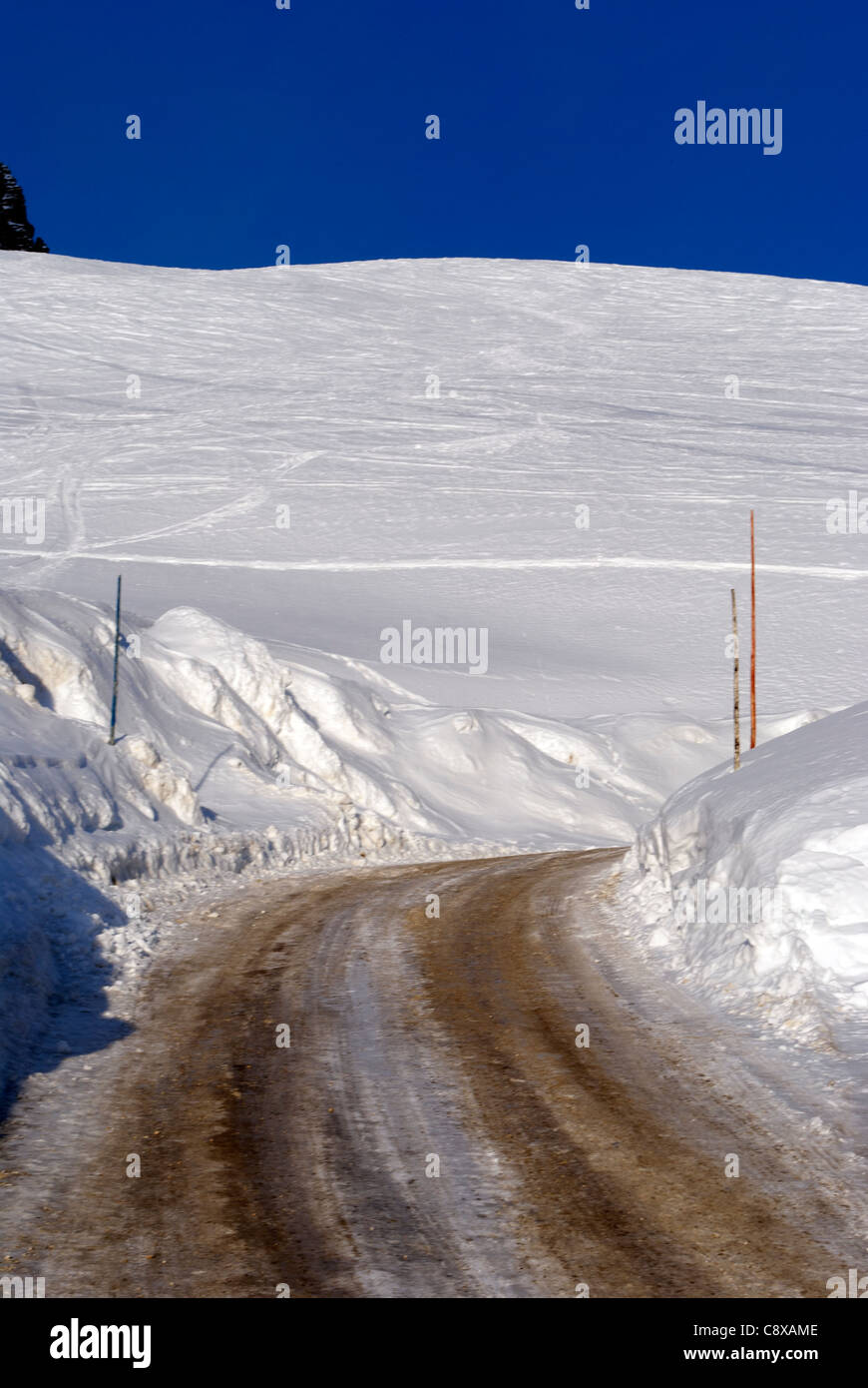snowy street in winter in the Italian Alps Stock Photo - Alamy