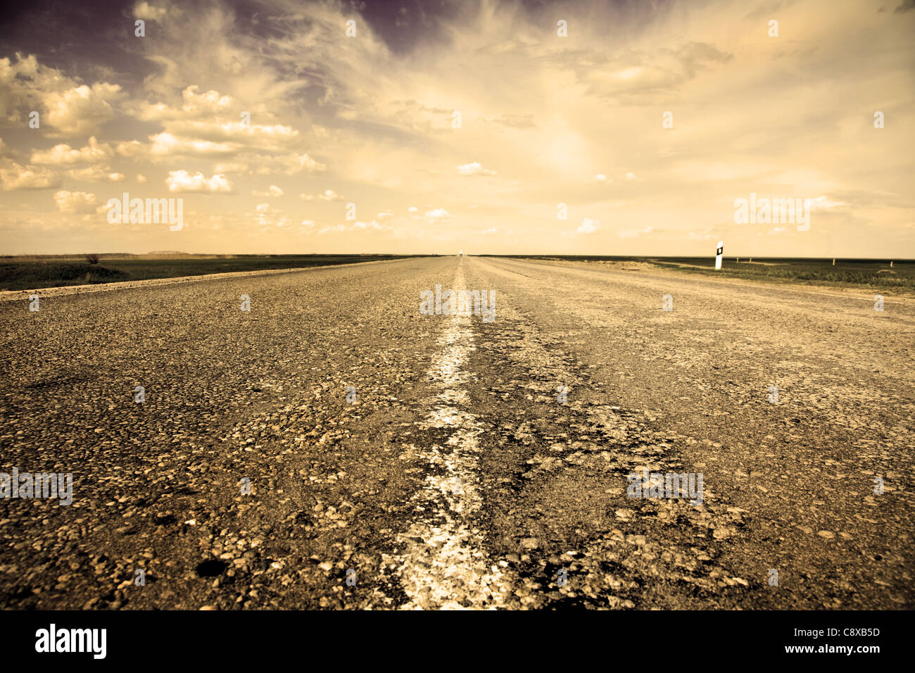 Sepia toned empty countryside old road Stock Photo - Alamy
