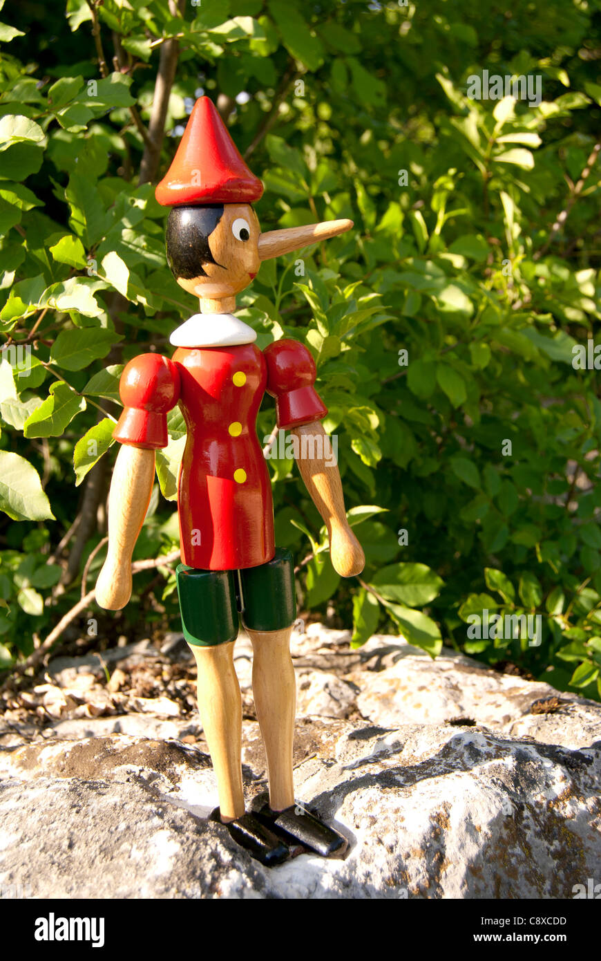 Pinocchio, italian wooden puppet with long nose, in the nature Stock ...