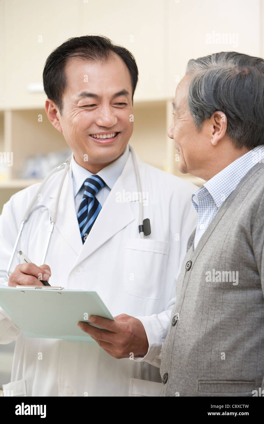 Doctor Shows a Senior Man a Chart Stock Photo - Alamy