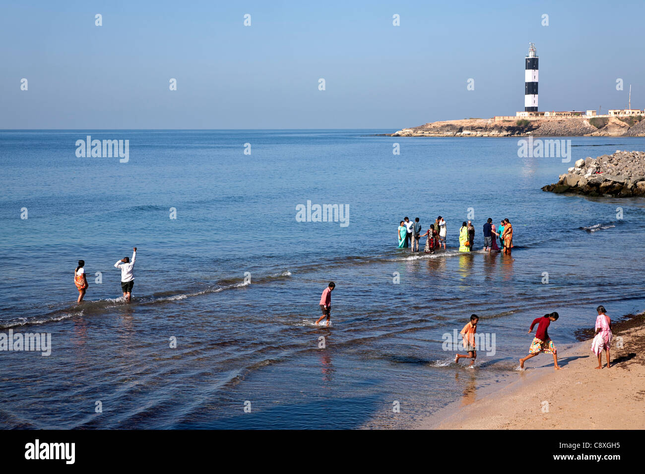 Indian people relaxing at the seaside. Dwarka. Gujarat. India Stock ...