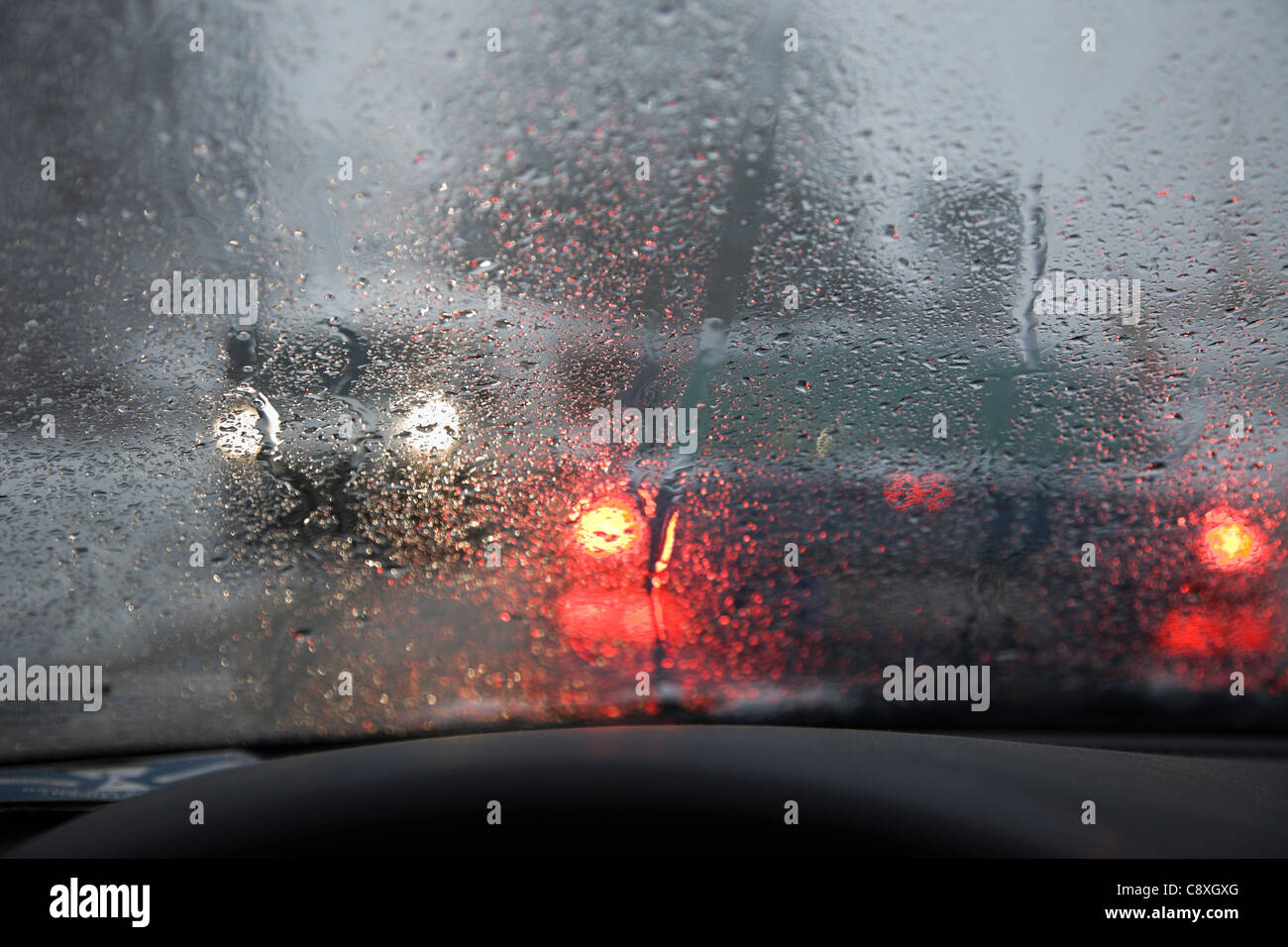 Cars through rainy windshield Stock Photo - Alamy