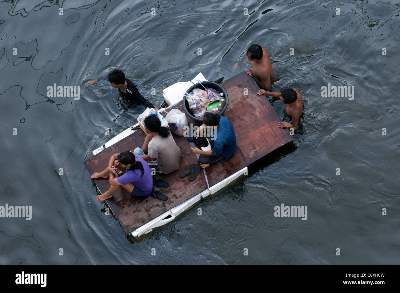 Natural disaster hits Bangkok. Thai refugees on an innovative makeshift ...