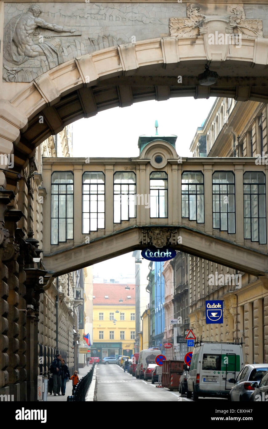 Prague, Czech Republic. Bridge crossing between buildings in Nekazanka ...