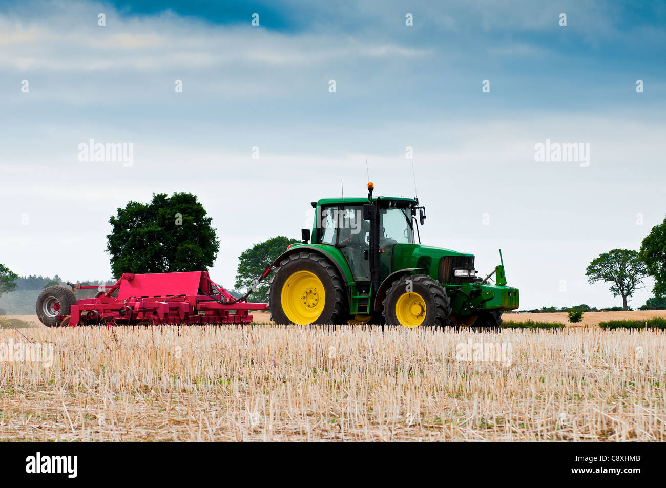 Tractor in a field Stock Photo - Alamy