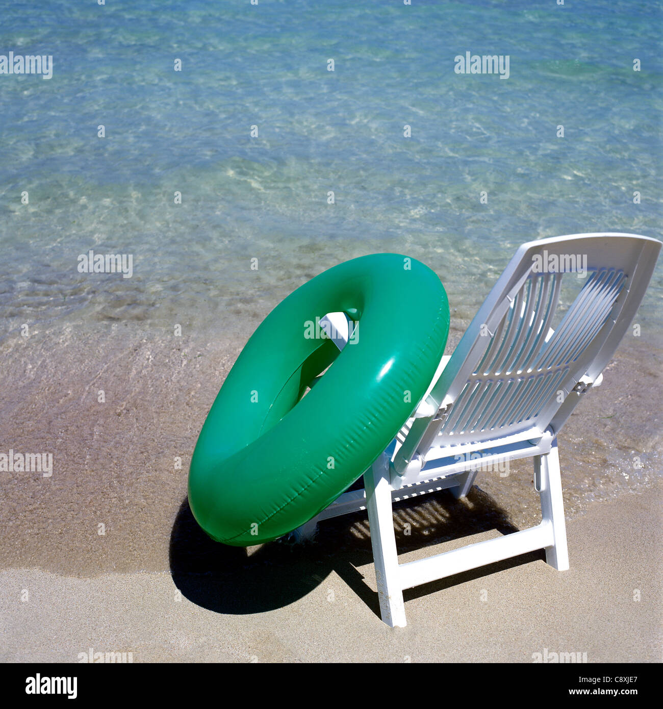 CHAIR AND RING ON BEACH Stock Photo - Alamy