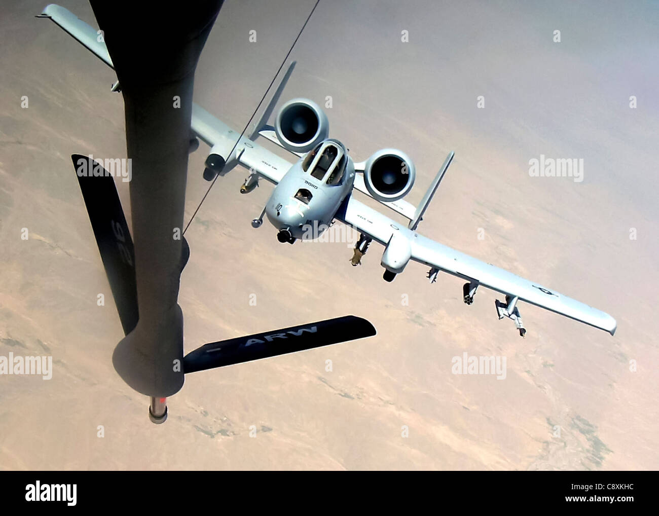 An A-10 Thunderbolt II moves into position behind a KC-135 Stratotanker ...