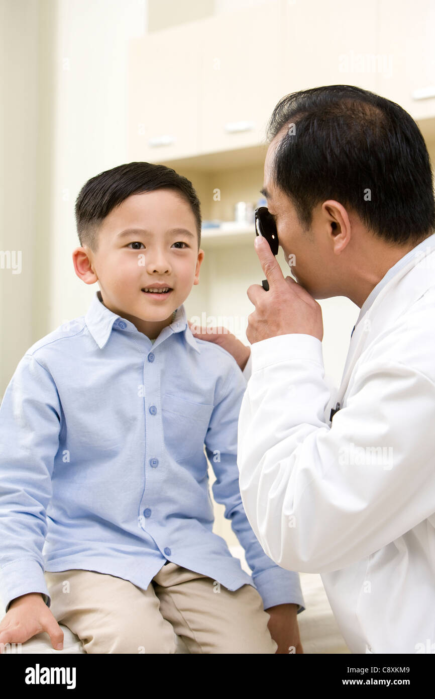 Young Boy is Examined by a Doctor Stock Photo - Alamy