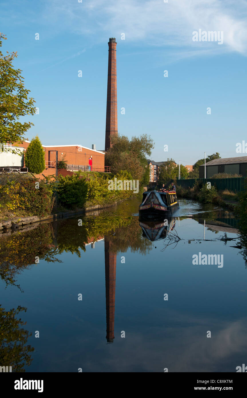 Chimney and factory reflected in canal hi-res stock photography and ...
