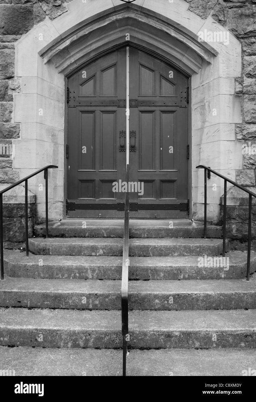 Old style church doors on a stone building with steps Stock Photo - Alamy