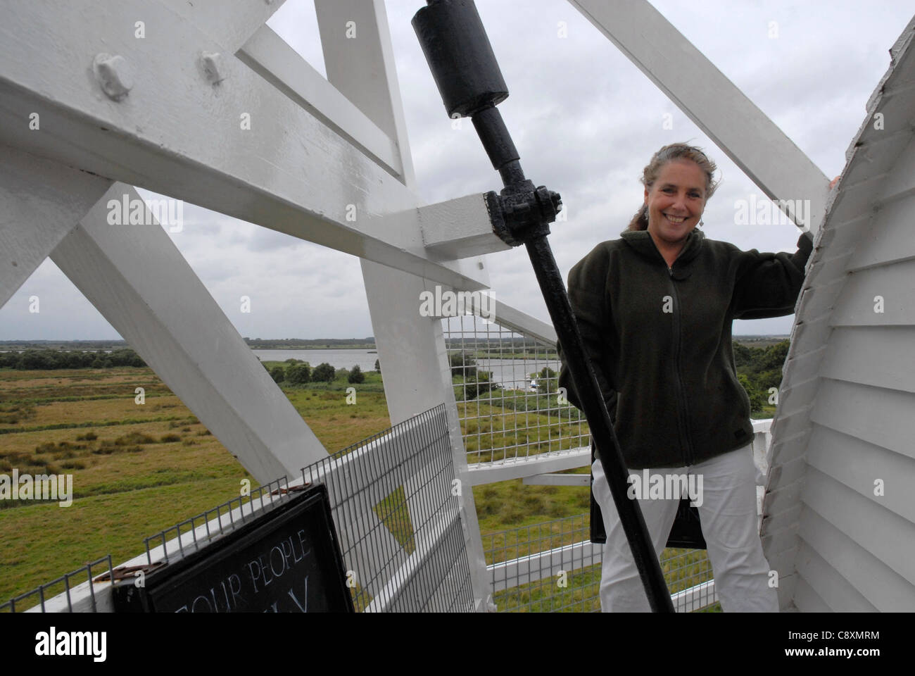 Woman standing on the top of a windmill Stock Photo - Alamy