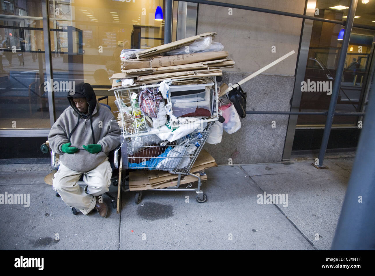 Homeless sitting street cart hi-res stock photography and images - Alamy