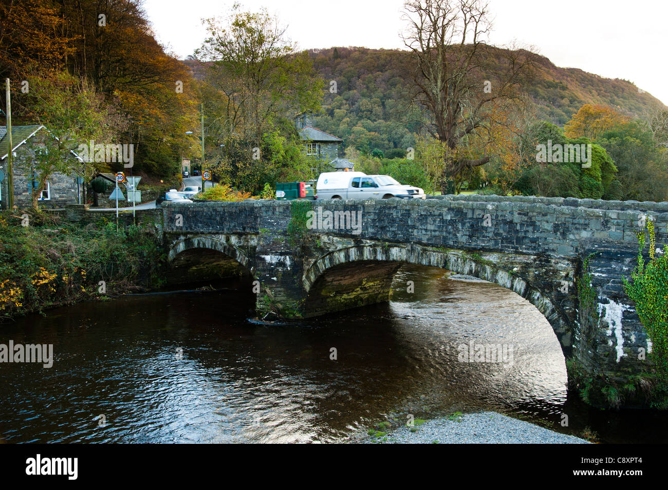 Traffic over the old stone bridge over the River Dwyryd, Maentwrog ...