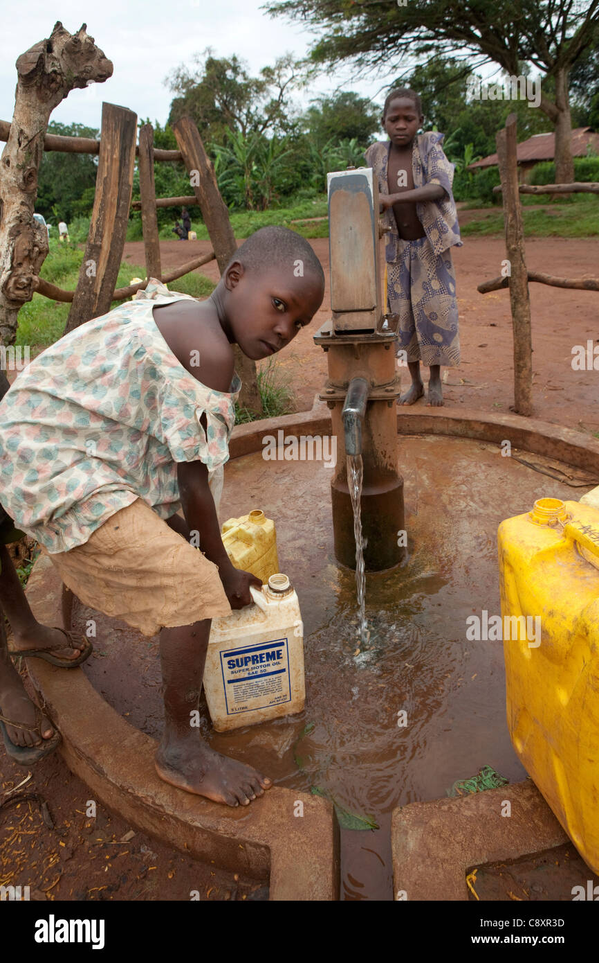 Children fetch water from a borehole in eastern Uganda's Namutumba ...