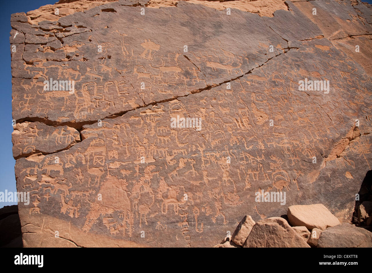 Ancient petroglyphs on a rock known as Graffiti Rock at Musayqirah ...