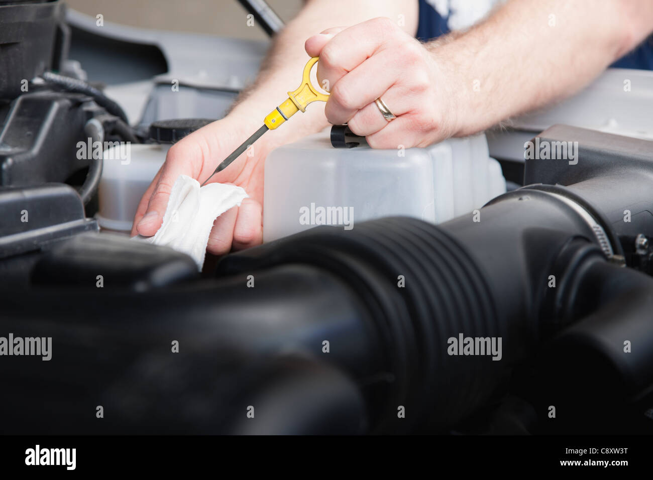Checking oil level hi-res stock photography and images - Alamy