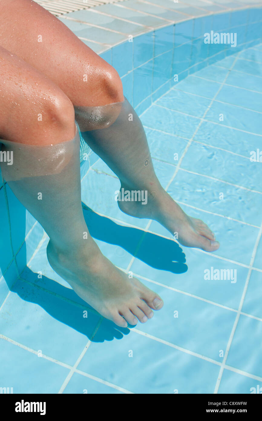Legs in swimming pool hi-res stock photography and images - Alamy