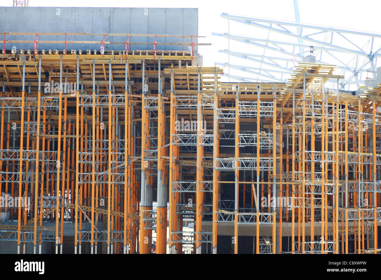 Construction site yellow scaffolding workplace Stock Photo - Alamy
