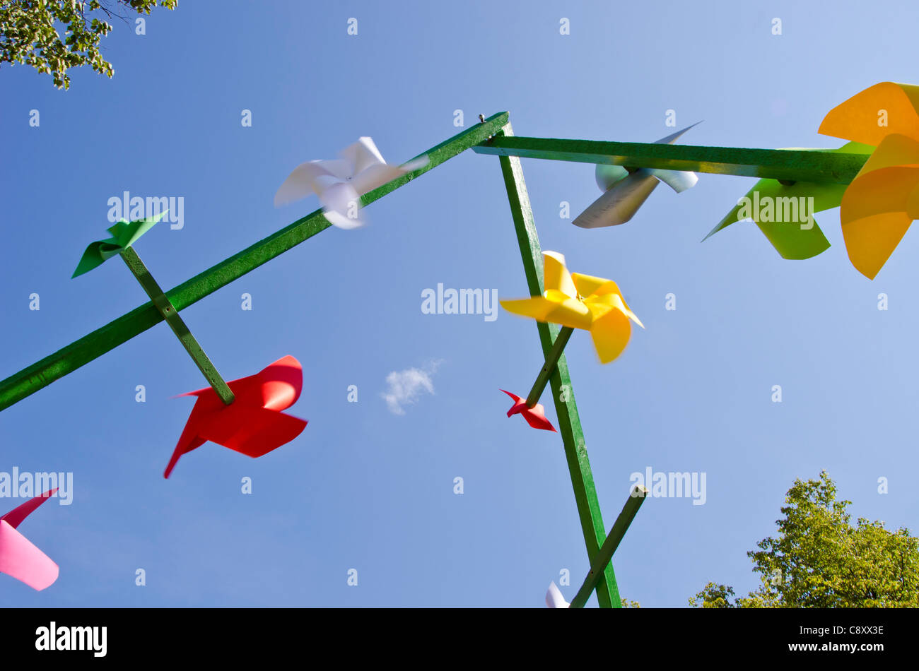 various colorful paper windmills and blue sky background Stock Photo ...