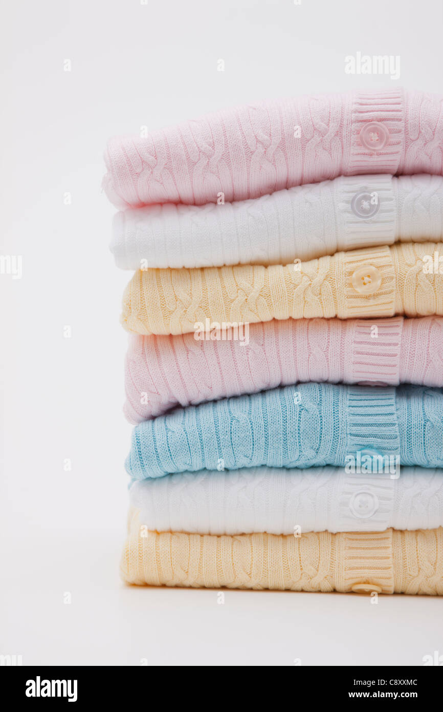 Stack of folded sweaters, studio shot Stock Photo - Alamy