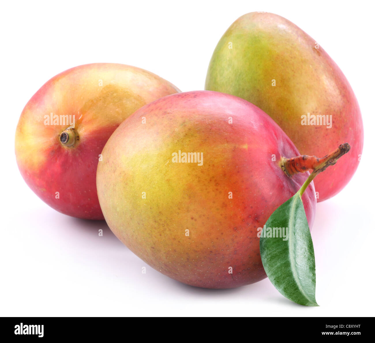 Three mango with leaf on a white background Stock Photo - Alamy