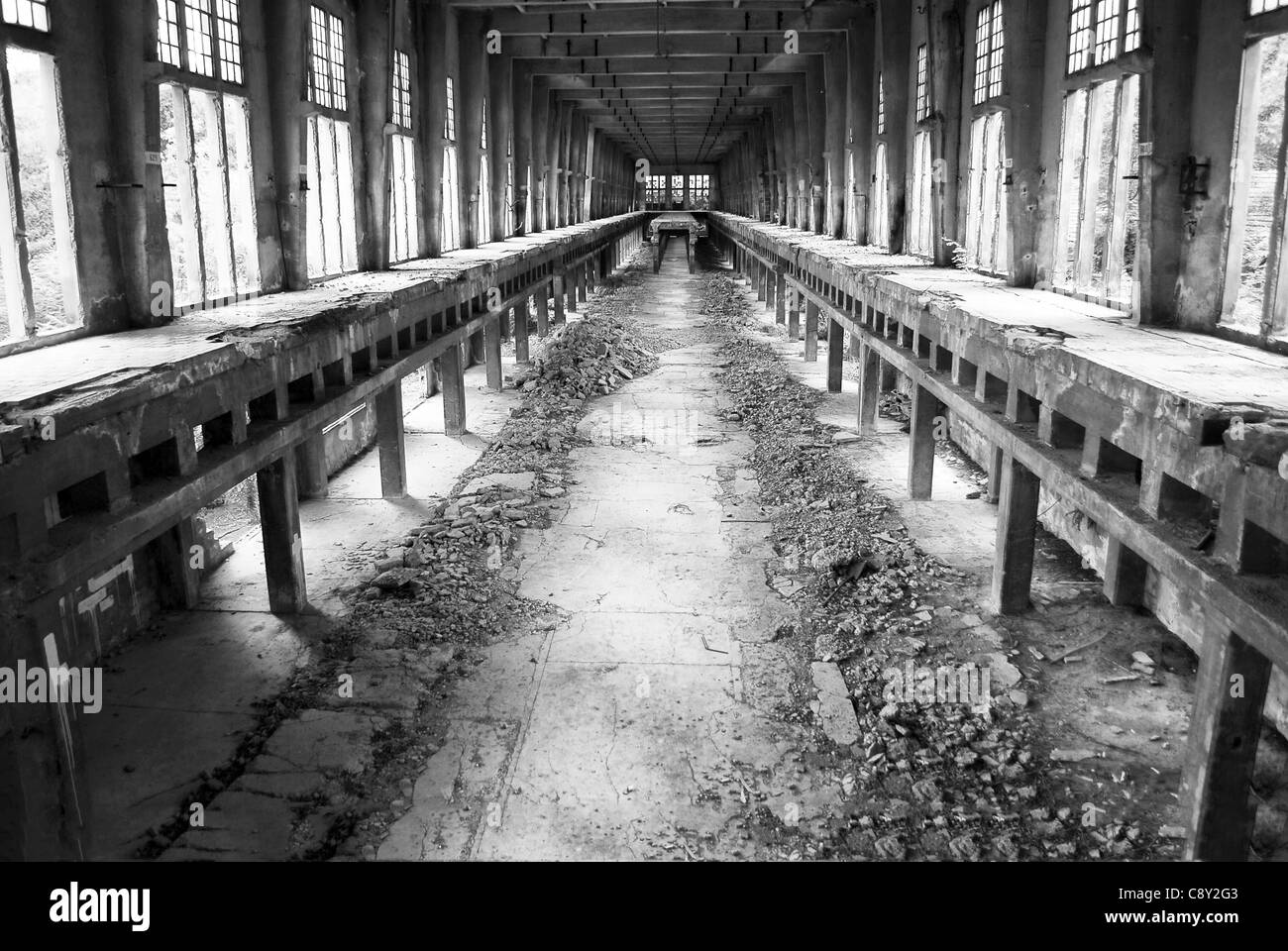 Abandoned factory room, with broken windows Stock Photo - Alamy