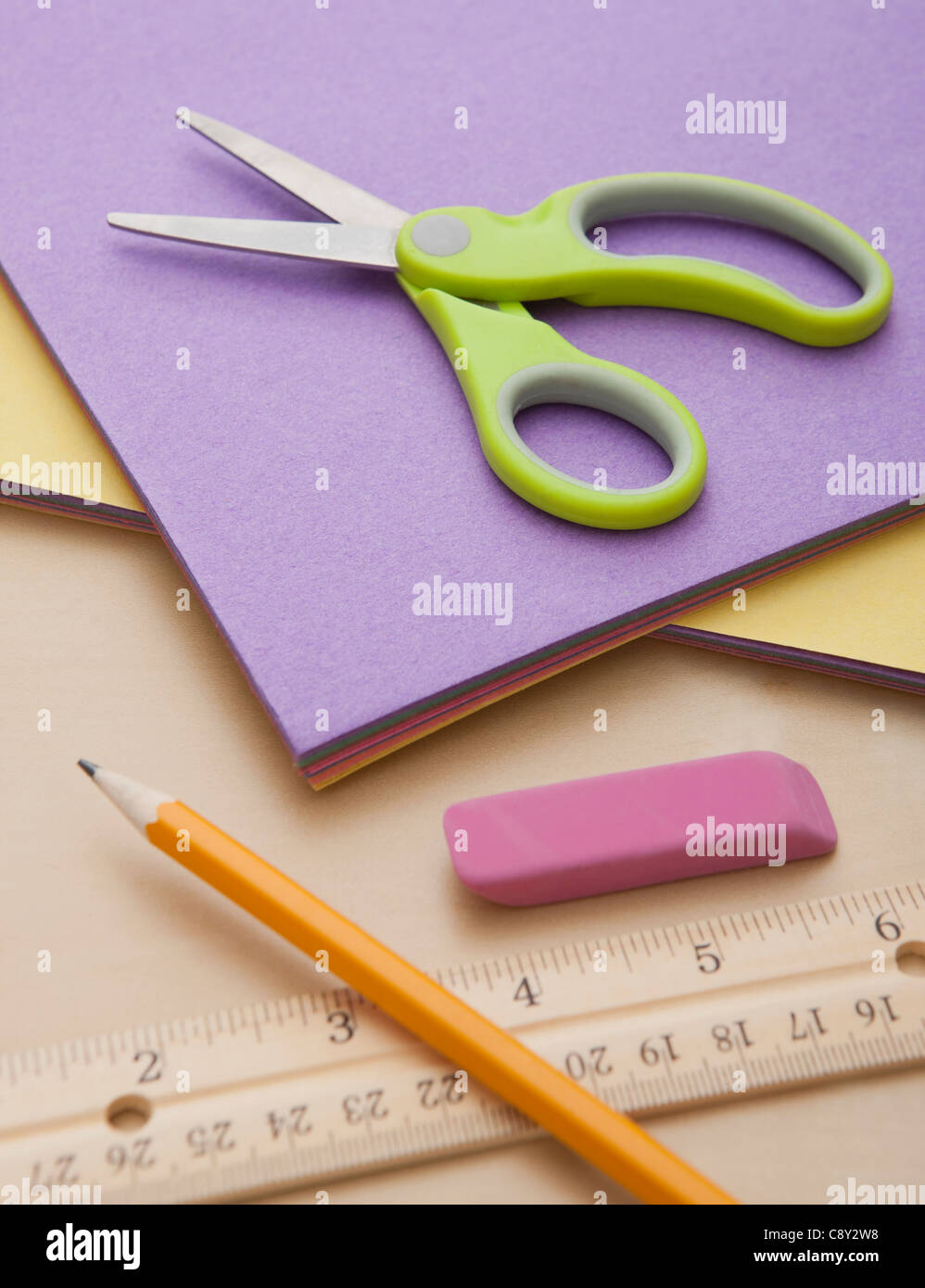 Studio shot of colored paper, scissors and pencil Stock Photo - Alamy
