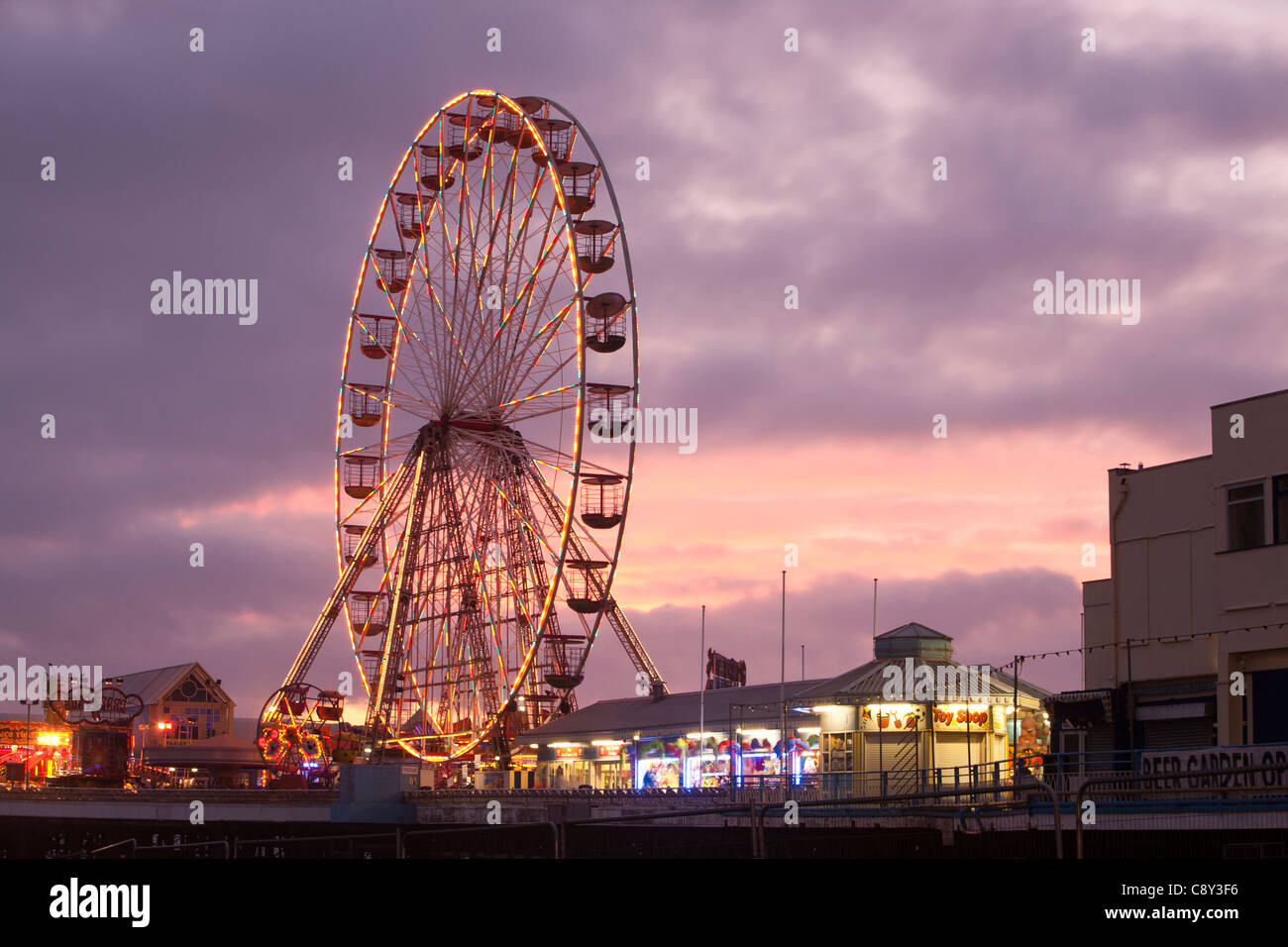 A ferris wheel on the South Pier at Blackpool at sunset Stock Photo - Alamy
