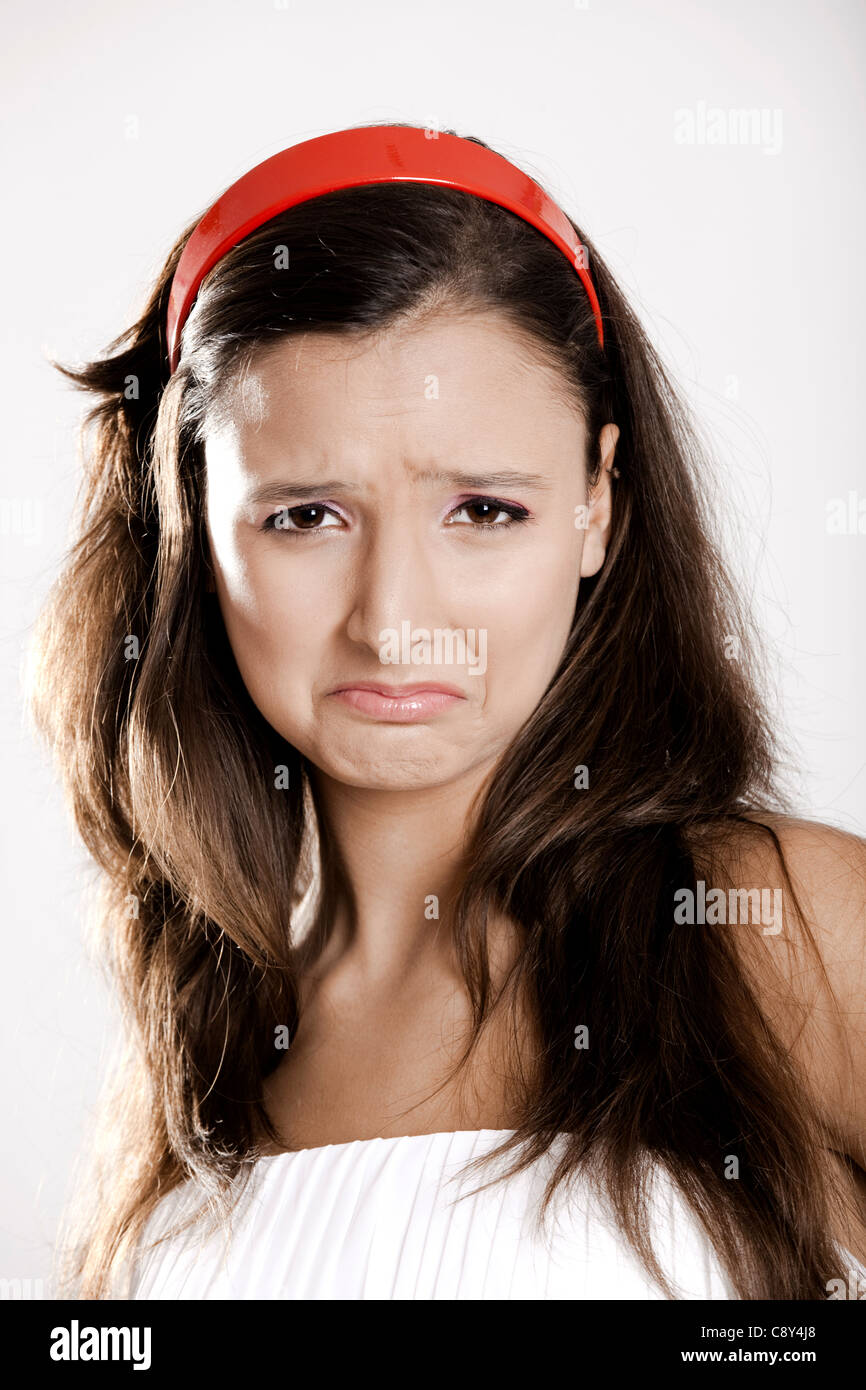 Portrait of a beautiful young woman crying, isolated on white Stock ...