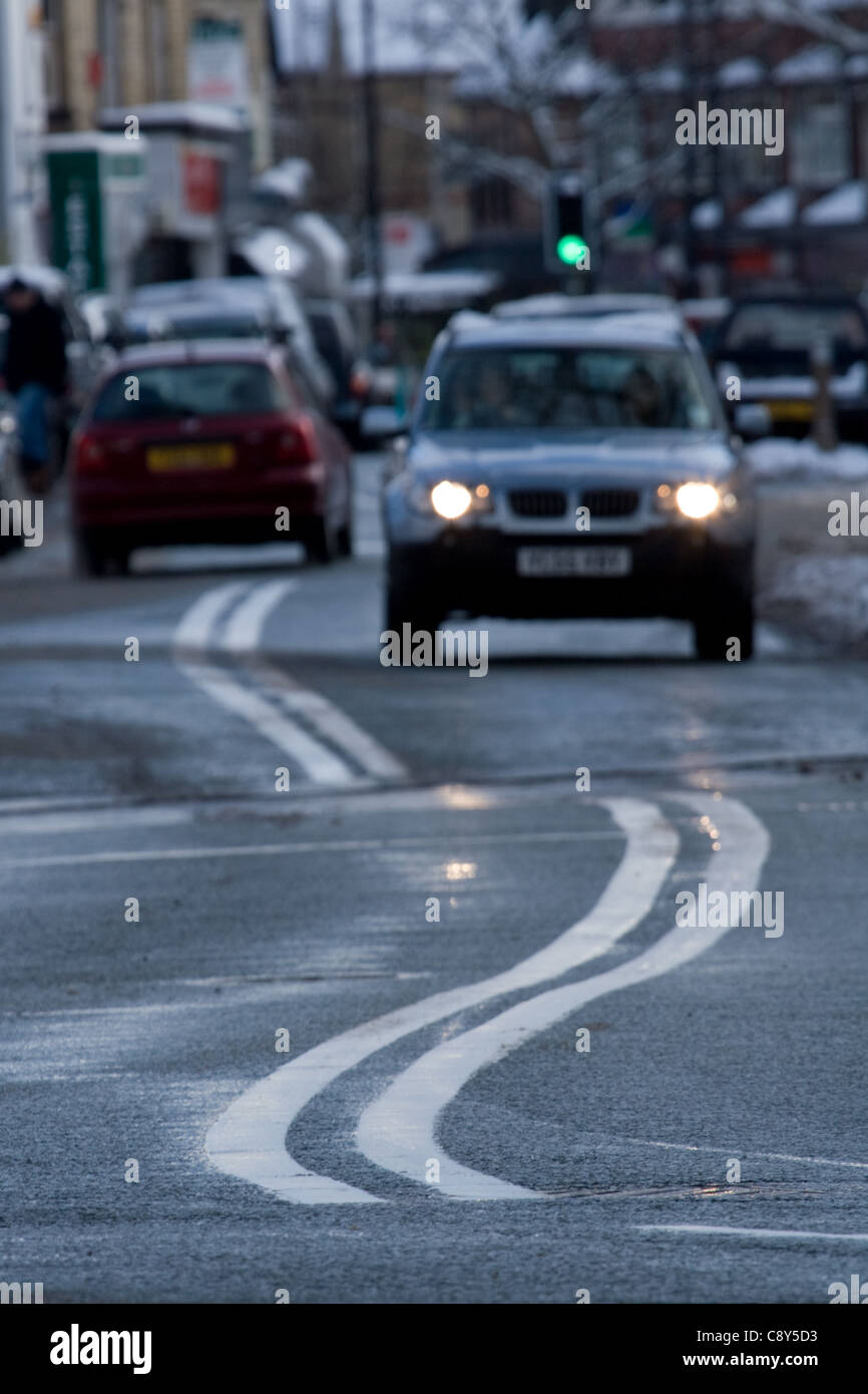 Wonky, winding road in winter road conditions Stock Photo - Alamy