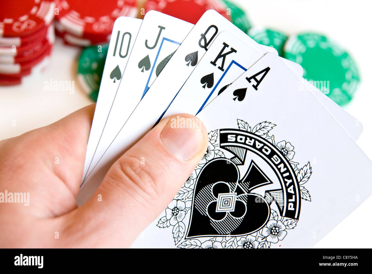 Hand full of cards on white background Stock Photo - Alamy