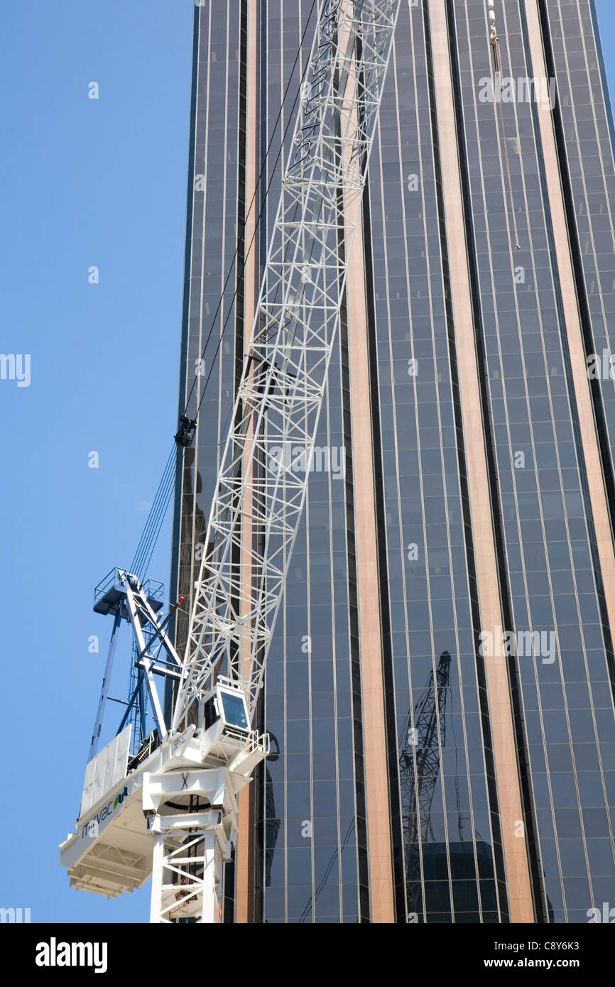tower crane image reflected in a skyscraper in sydney Stock Photo - Alamy