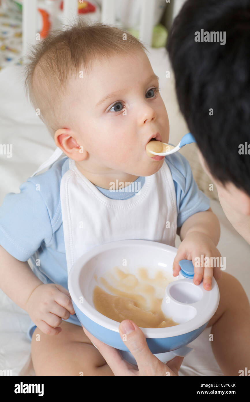 mother feeding baby boy Stock Photo - Alamy