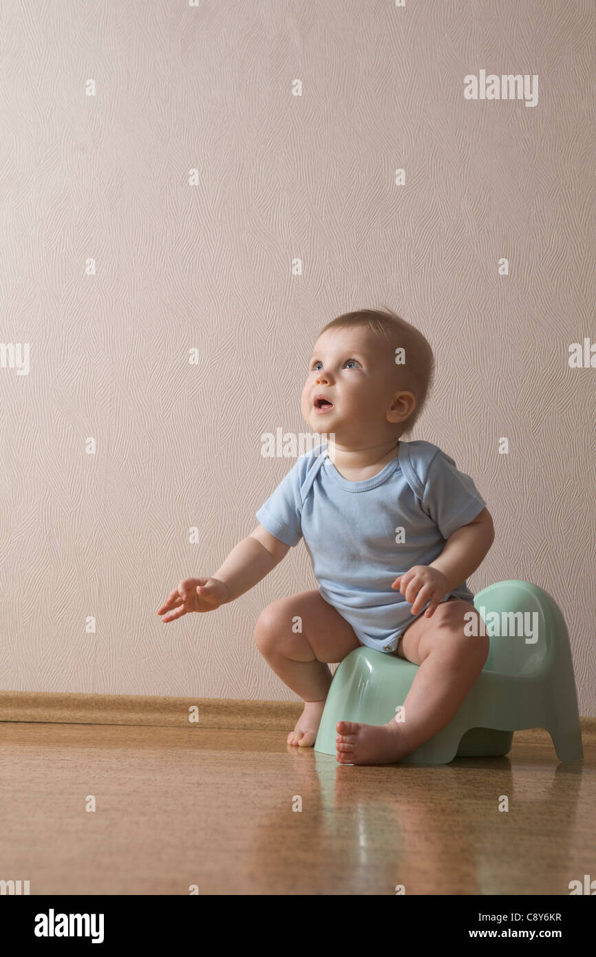 baby boy sitting on potty Stock Photo - Alamy