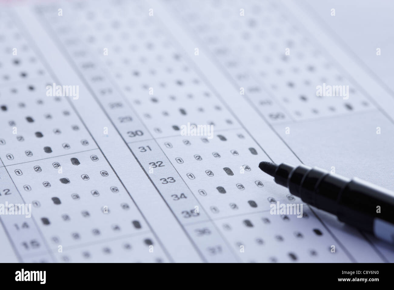 Test Answer Sheet With Black Pen Stock Photo - Alamy