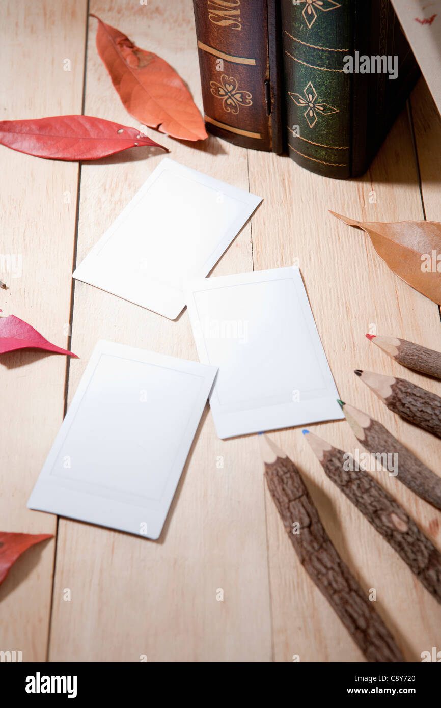 Fallen Leaves With White Papers An Wooden Pencils Stock Photo - Alamy