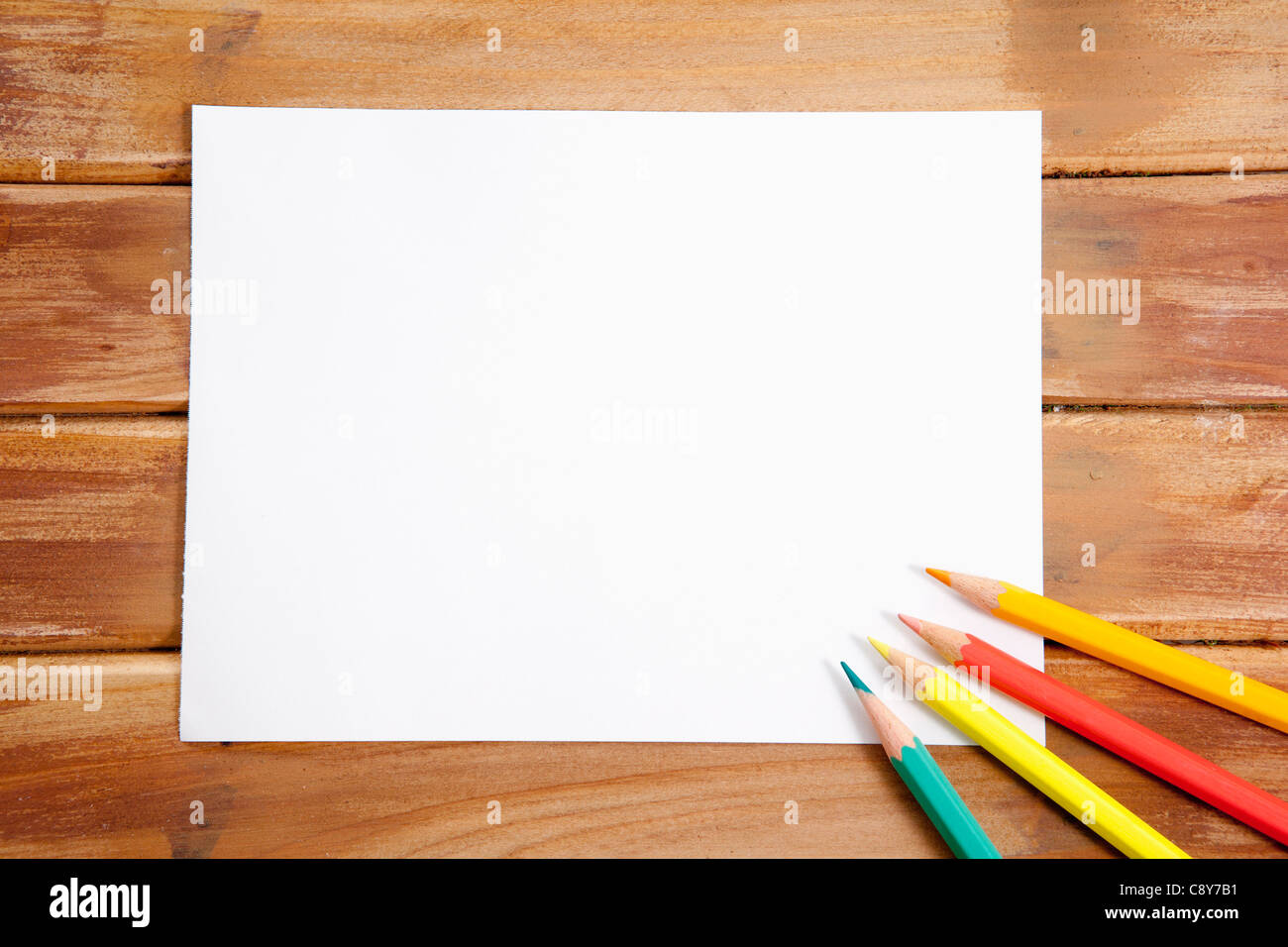 Four Color Pencils Over White Paper Stock Photo - Alamy
