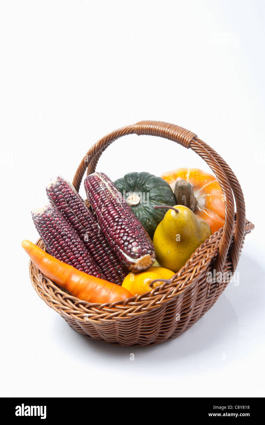 Autumn With A Basket Of Harvested Crops Stock Photo - Alamy