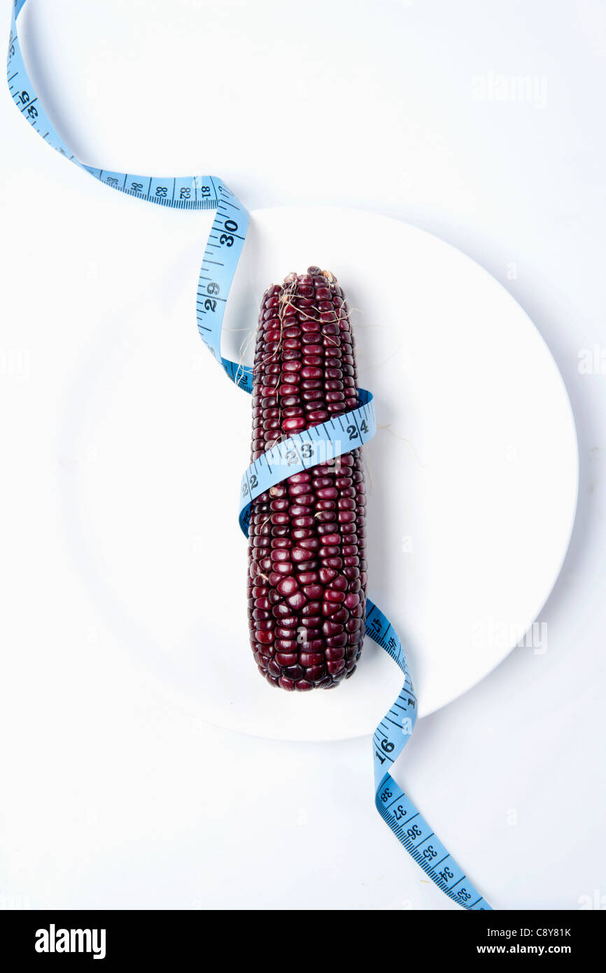 A Plate Of Purple Corn And Tape Measure Stock Photo - Alamy